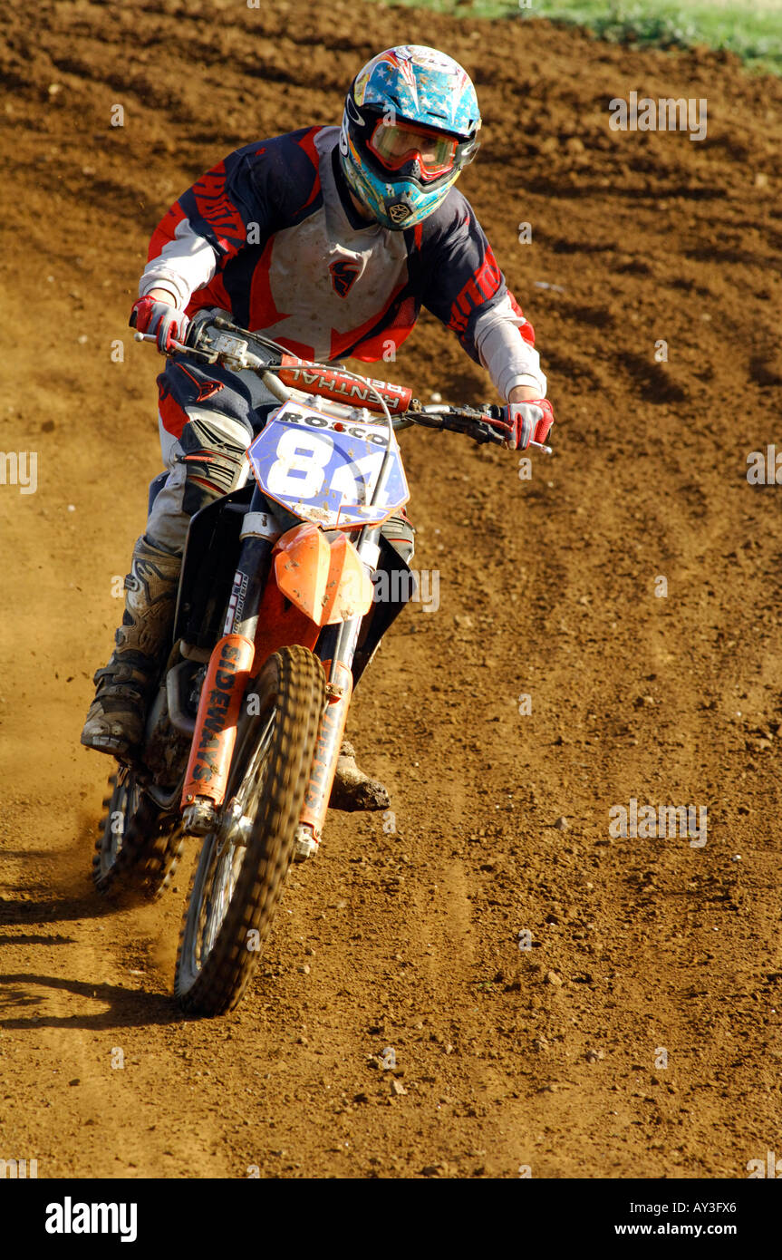 a guy rider on a motocross bile motorcycle jumping and racing big air ...