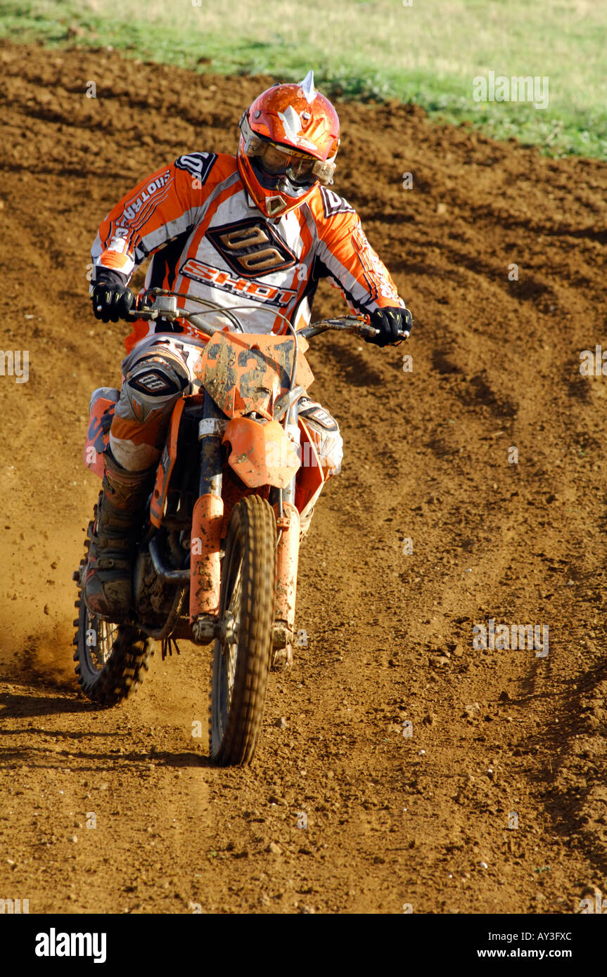 a guy rider on a motocross bile motorcycle jumping and racing big air ...