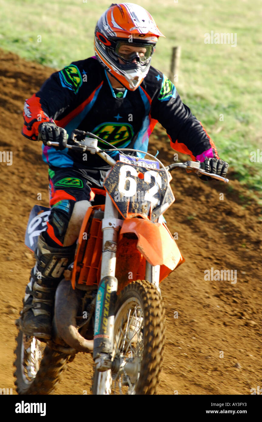 a guy rider on a motocross bile motorcycle jumping and racing big air ...