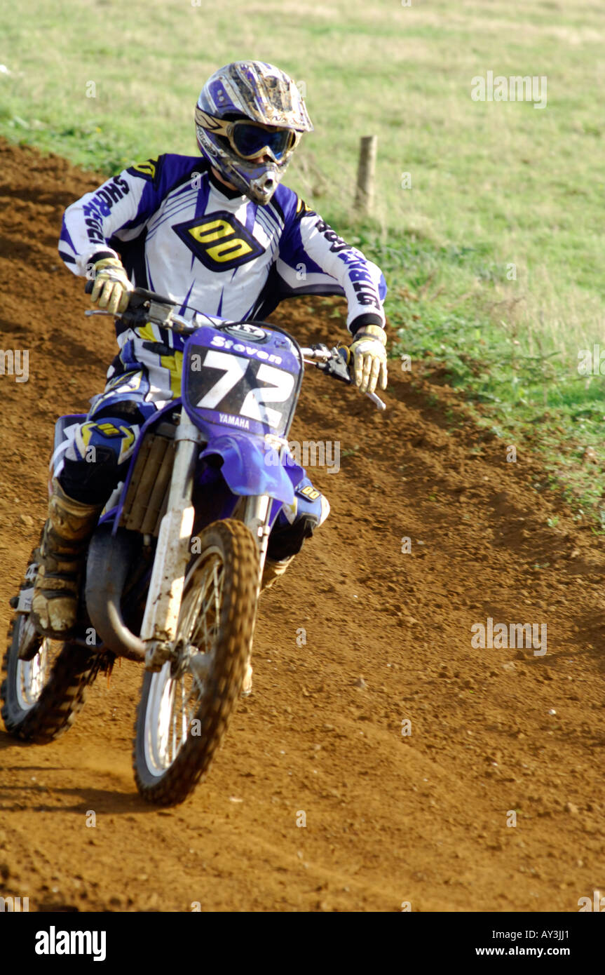 a guy rider on a motocross bile motorcycle jumping and racing big air ...