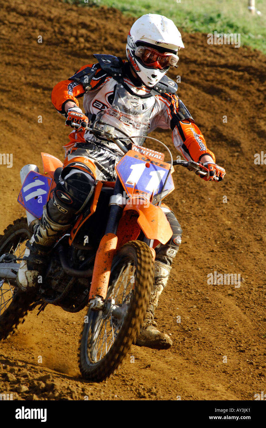 a guy rider on a motocross bile motorcycle jumping and racing big air ...