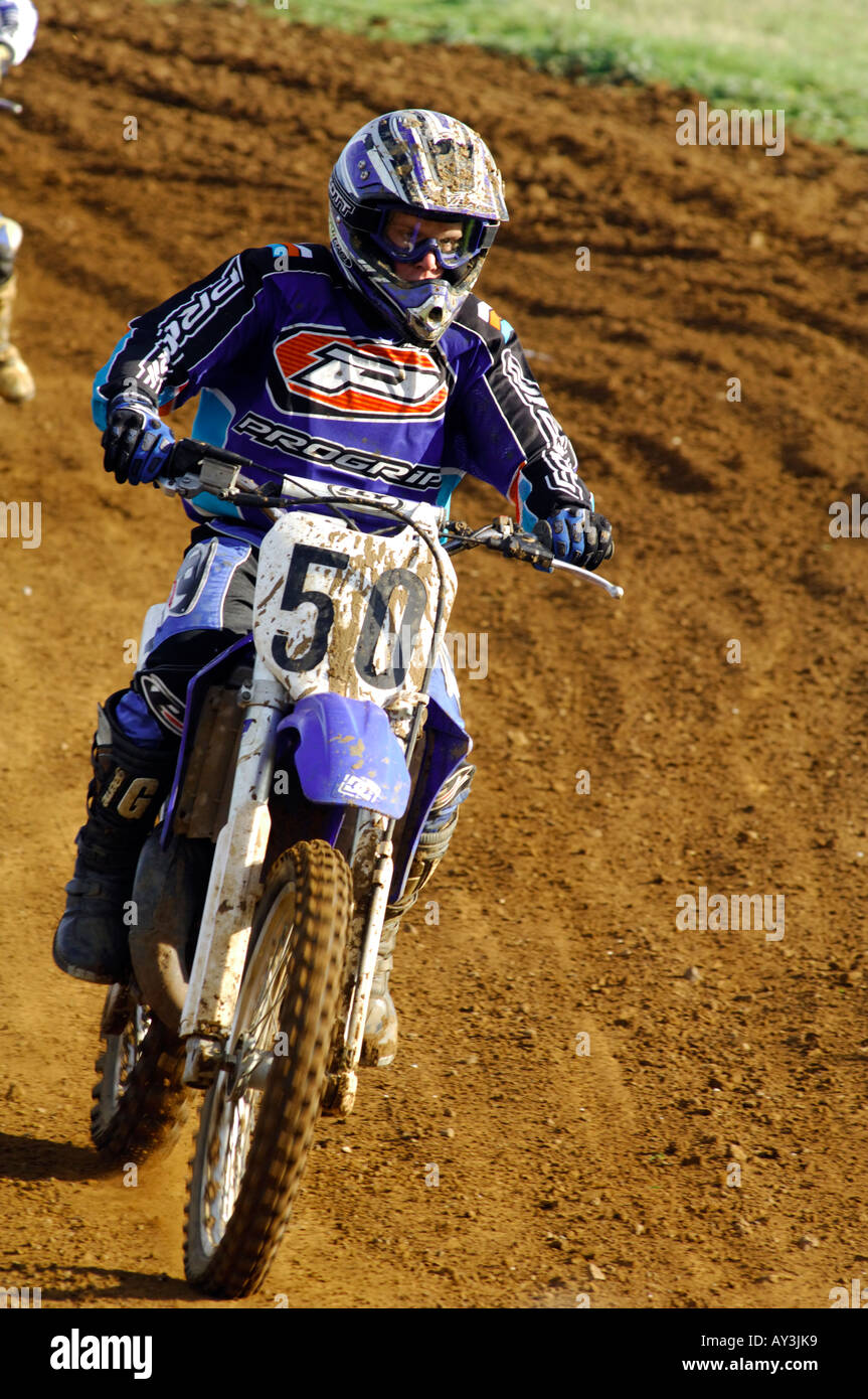 a guy rider on a motocross bile motorcycle jumping and racing big air ...