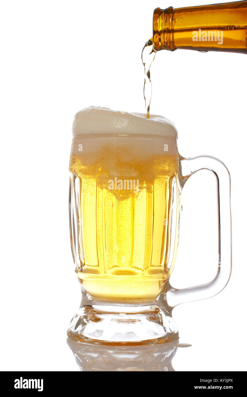 Pouring beer into mug reflected over white background Stock Photo - Alamy