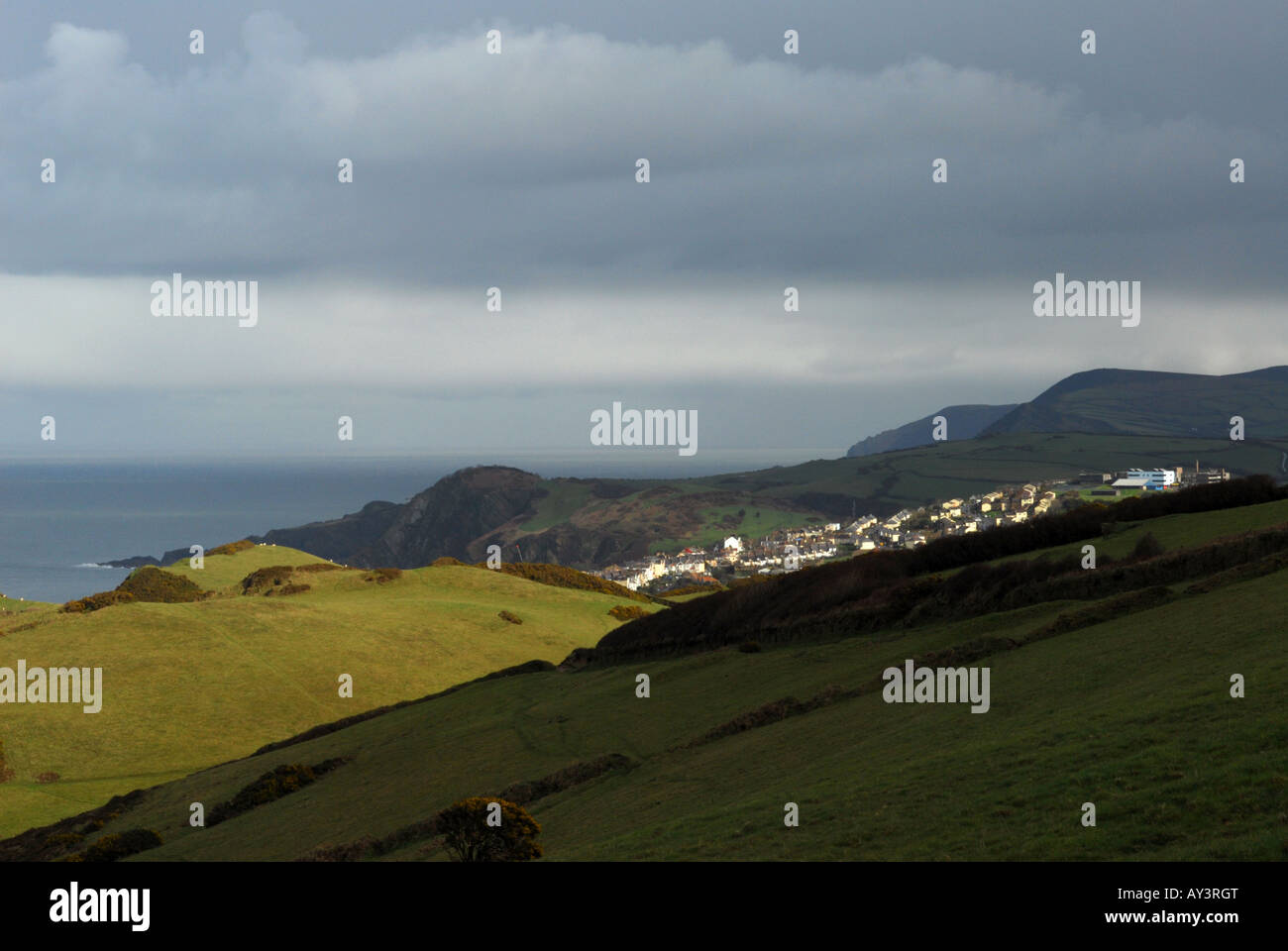 Sunshine breaks through the clouds on a stormy day on the North Devon ...