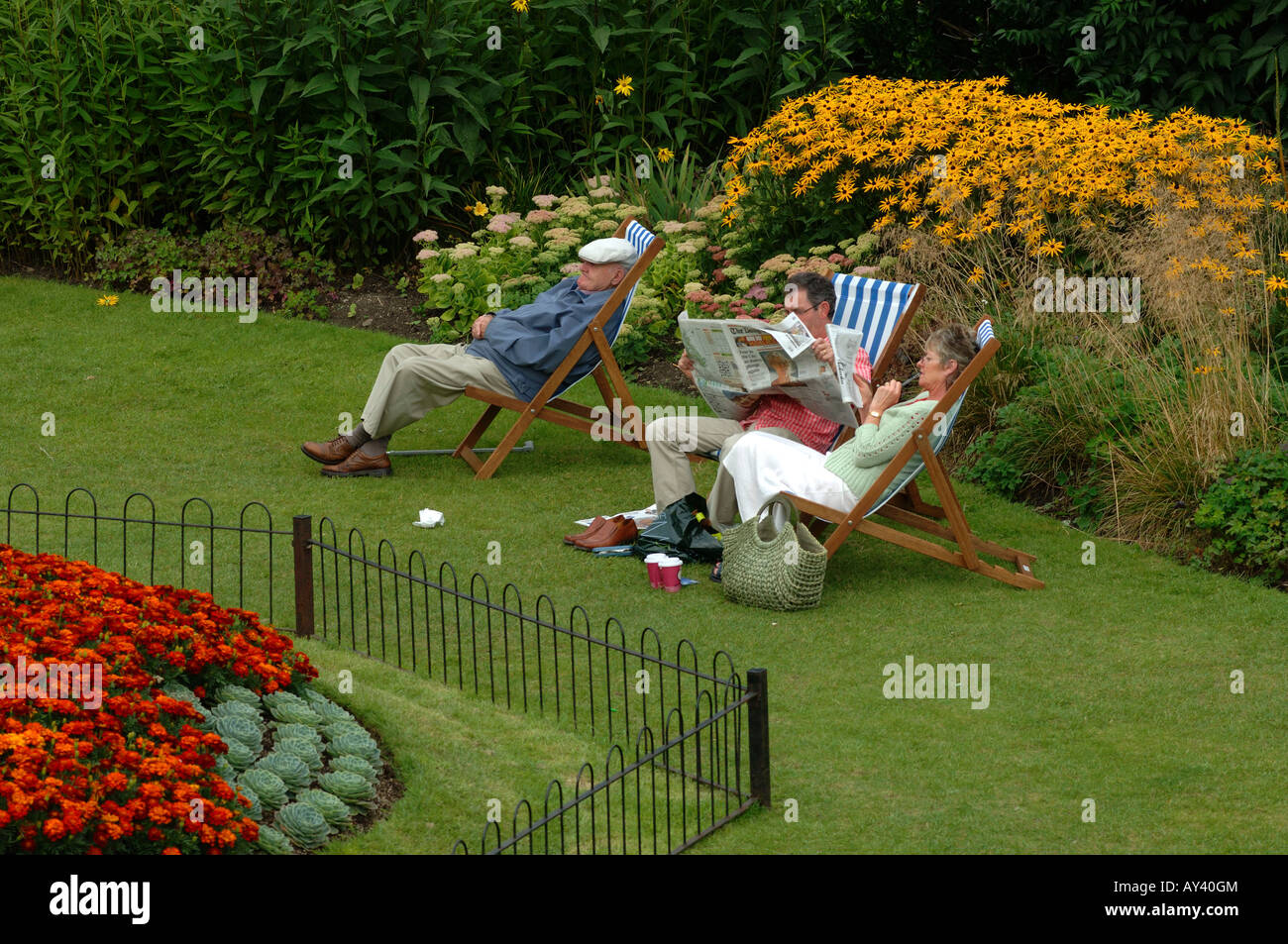 Women deckchairs hi-res stock photography and images - Alamy