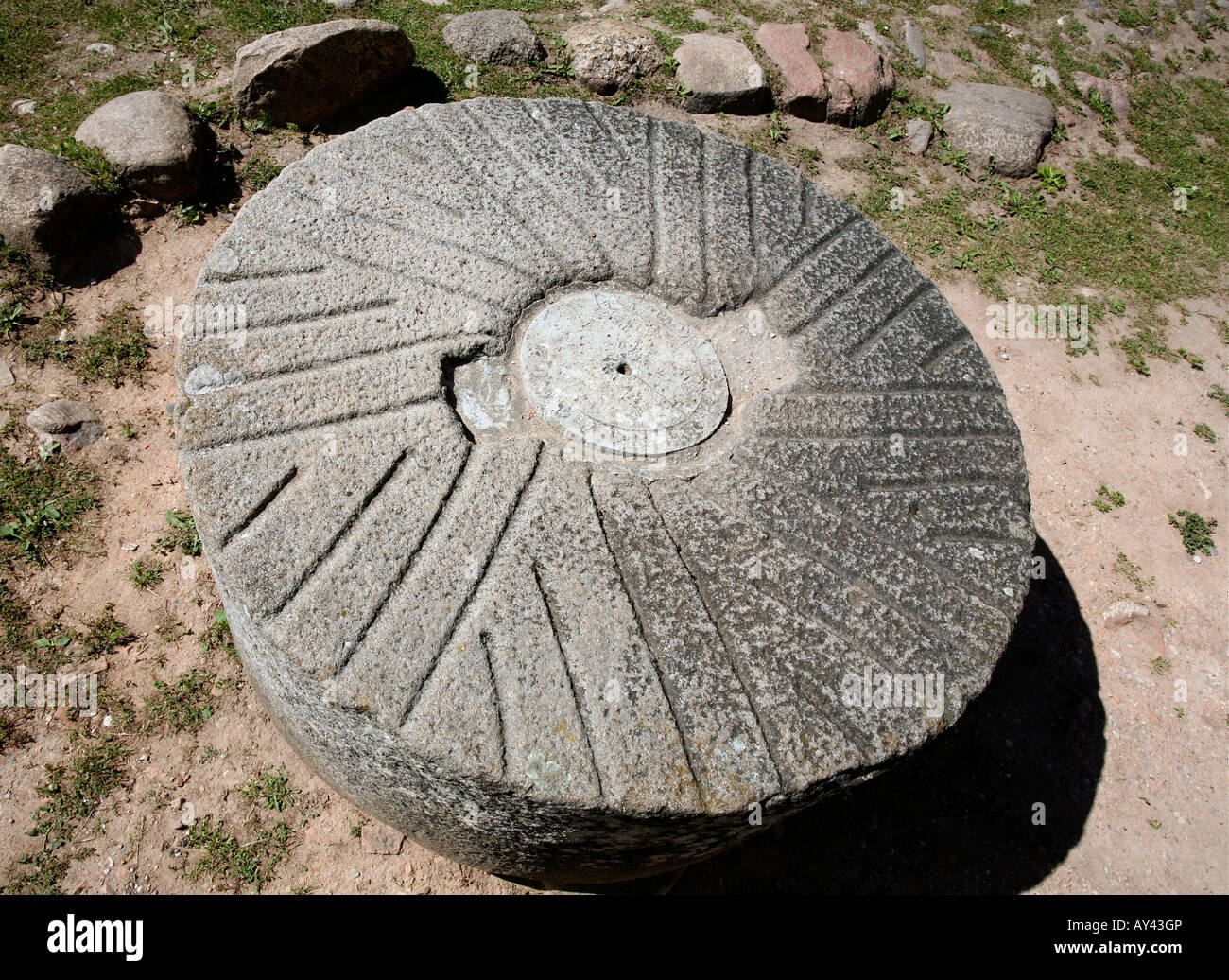 grinding wheel for making flour from grain, large stone, outside in the ...