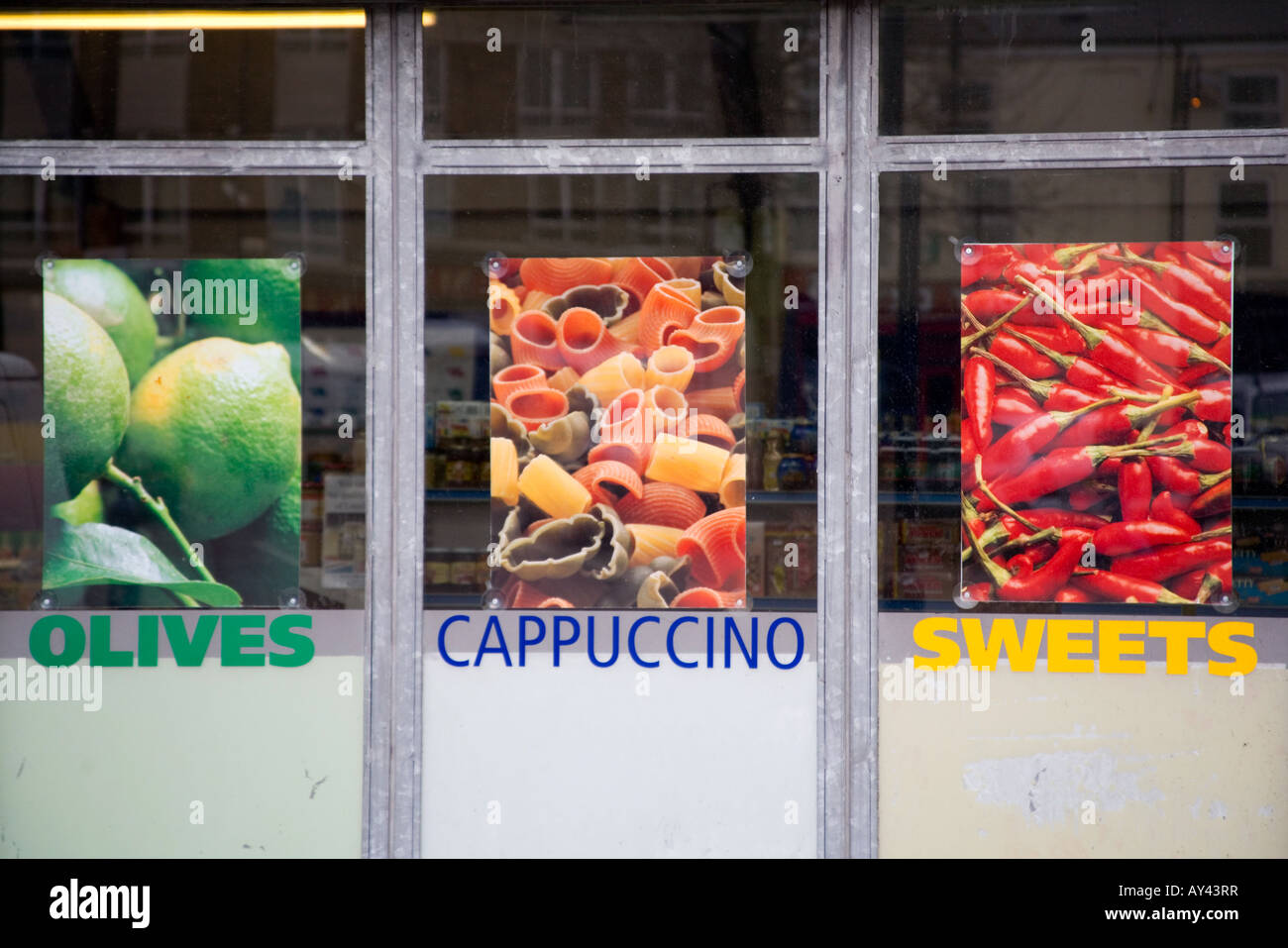 A shop window showing adverts for food products Stock Photo - Alamy