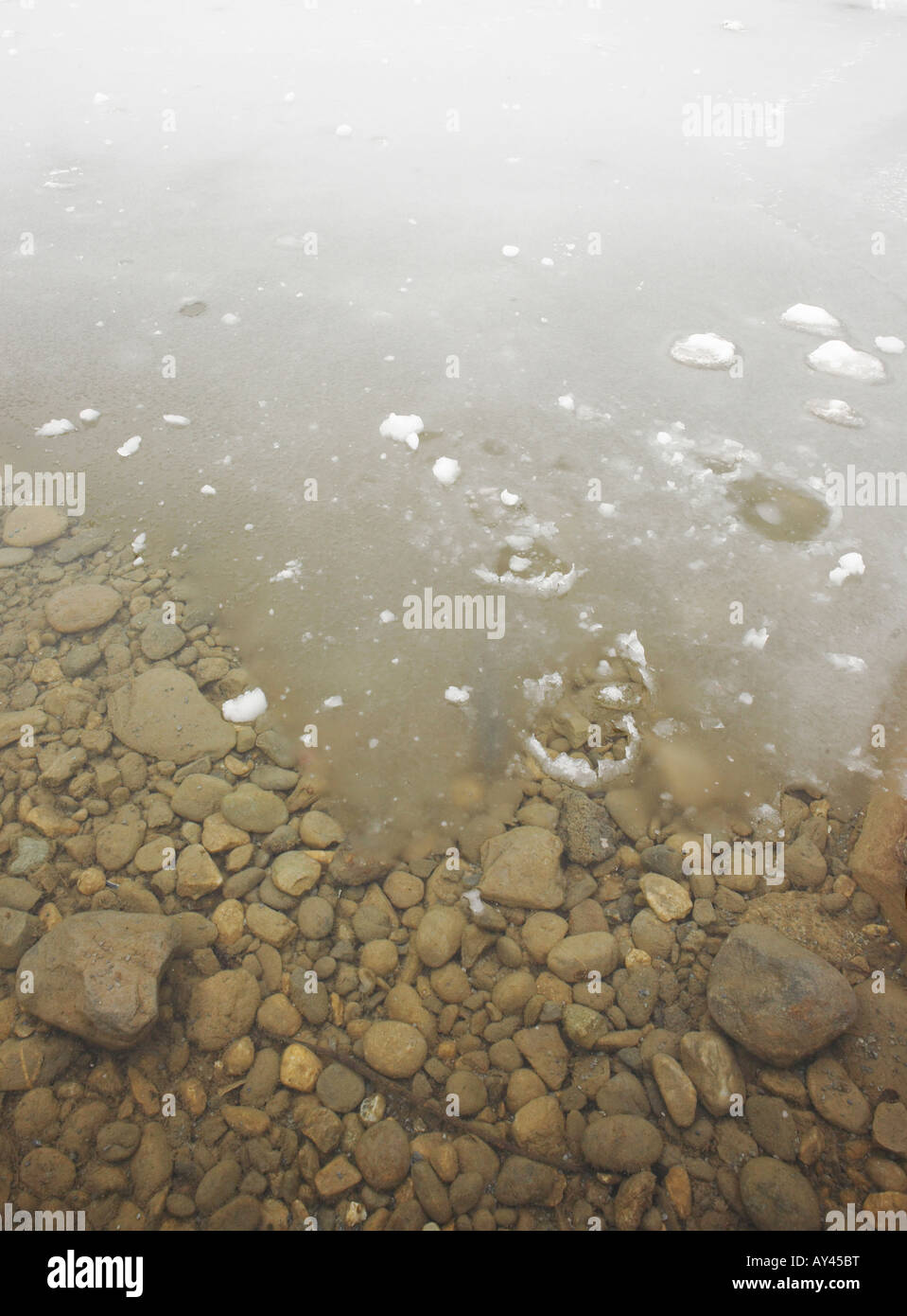 Partly frozen over pond Stock Photo - Alamy