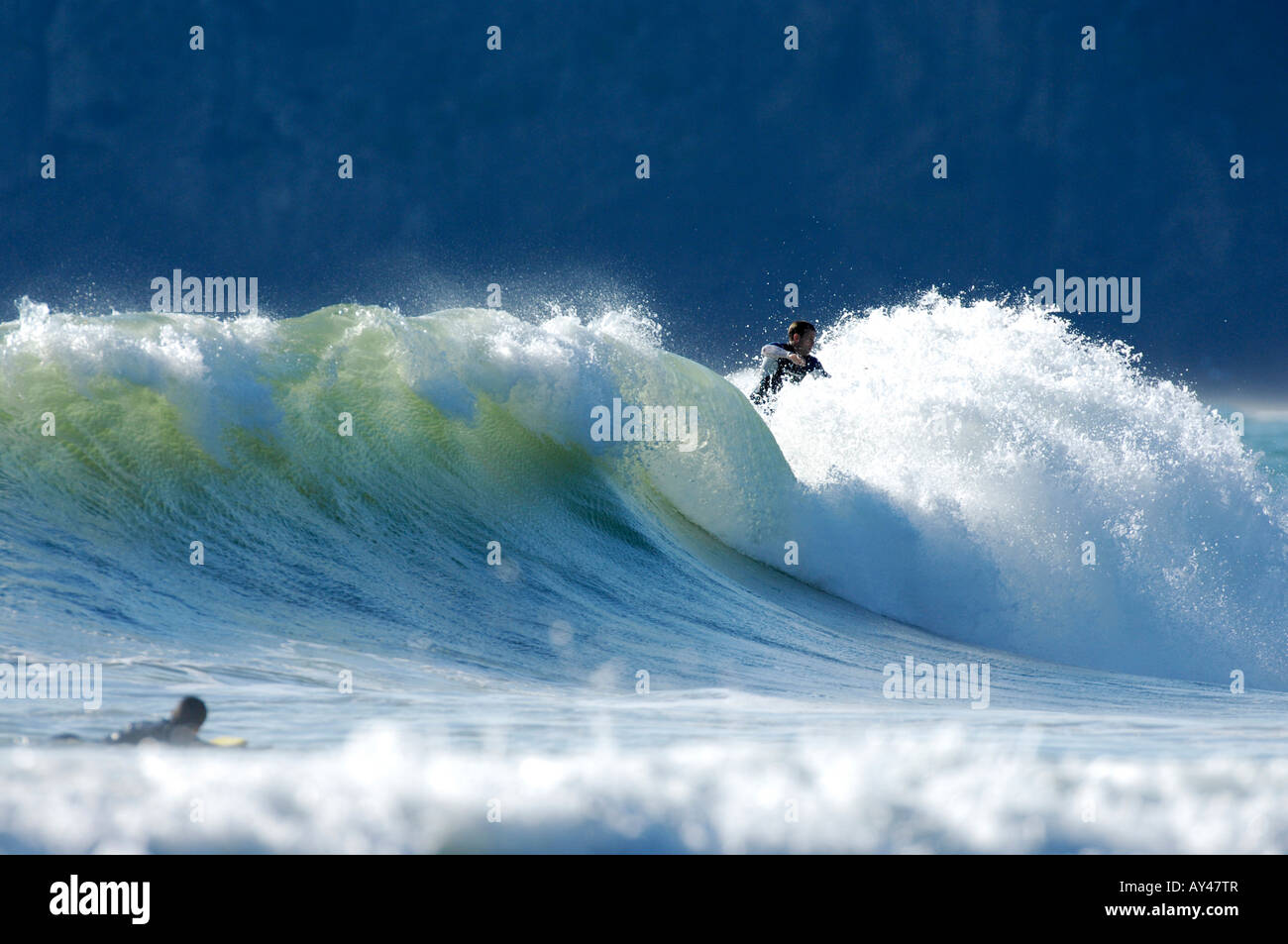Surfing at Piha Beach, New Zealand Stock Photo - Alamy