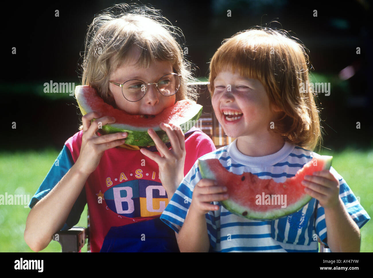 girls enjoy watermelon Stock Photo - Alamy
