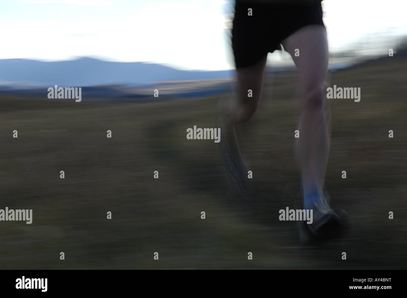 Trail running with mountains in the background motion blur Stock Photo ...