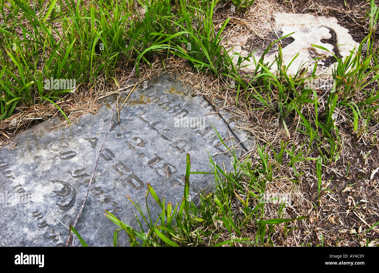 Fallen over tombstone in a pioneer cemetery Stock Photo - Alamy