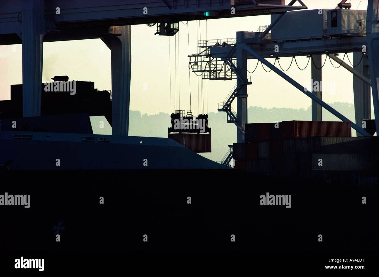 Crane loading a shipping container on a large trans Pacific container ...