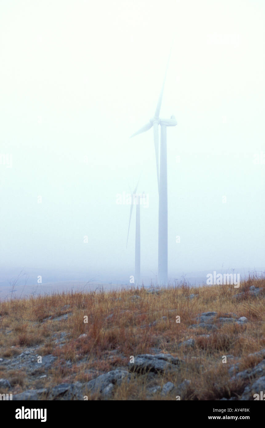 Wind turbines in the fog at a wind Farm Stock Photo - Alamy