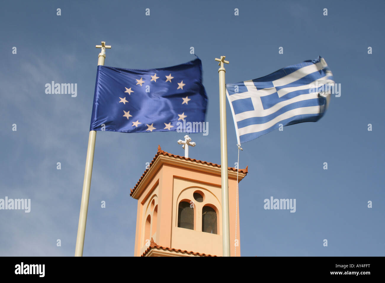 European and Greek flag flying together at church in the mountain ...