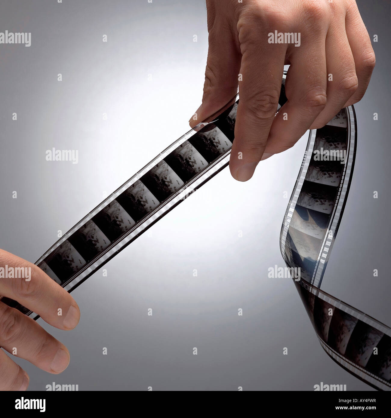 hand holding a strip of film Stock Photo - Alamy