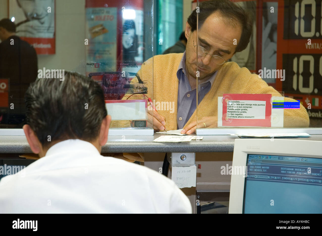 Clients and bank employees shown at a branch of Scotiabank Inverlat in ...