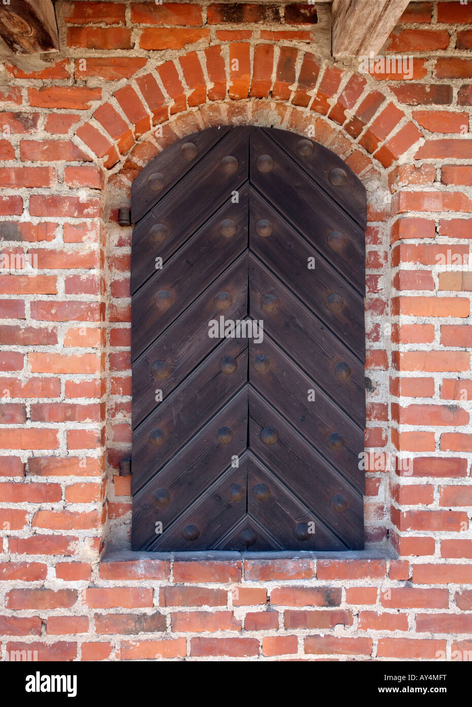 castle wall wood shutters brick arched frame Stock Photo - Alamy