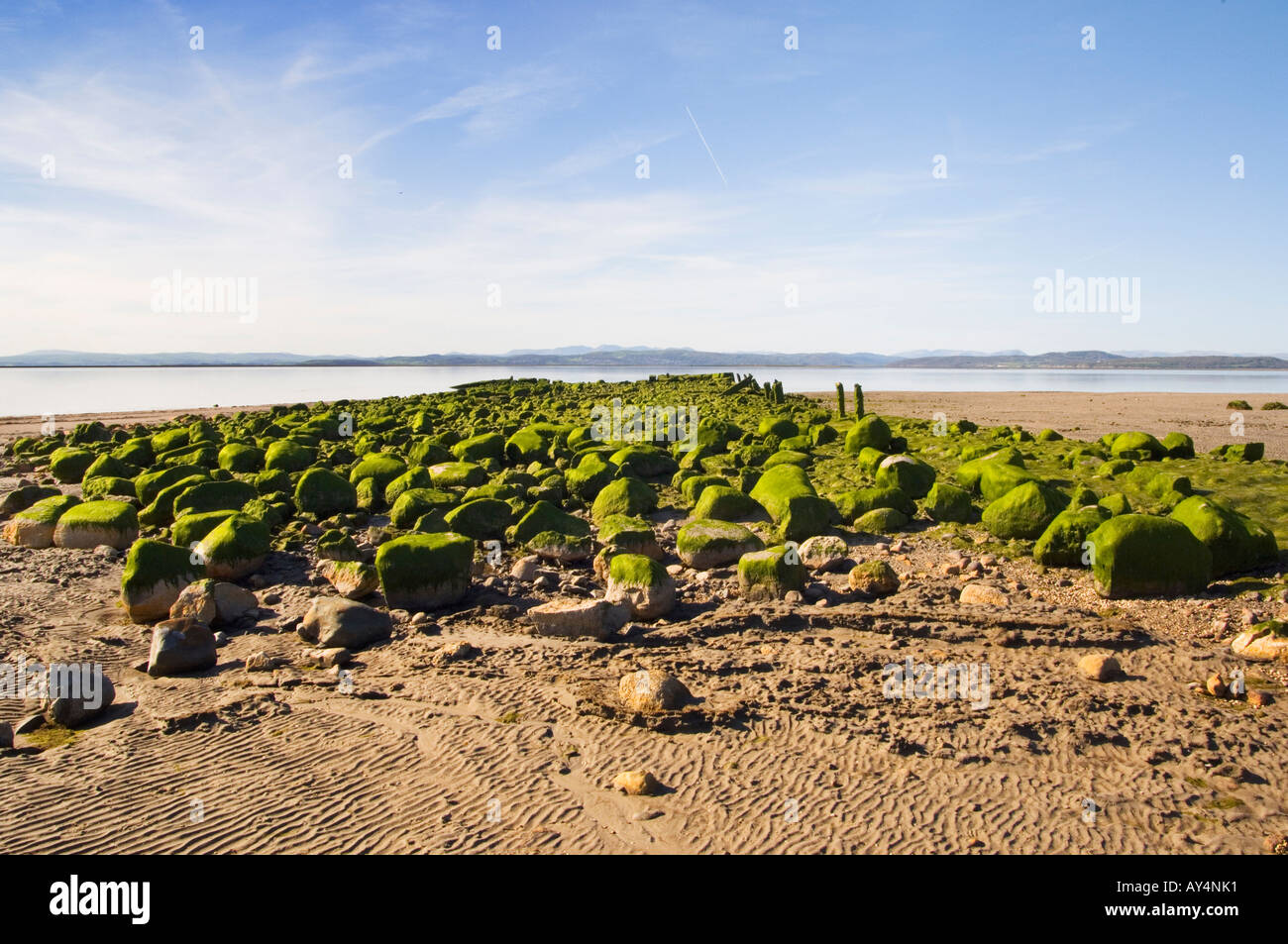 Remains of old pier at Hest Bank Lancashire with Morecambe Bay and ...