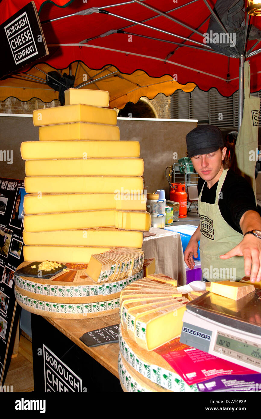London Borough Market The Borough Cheese Company stall large high piles ...