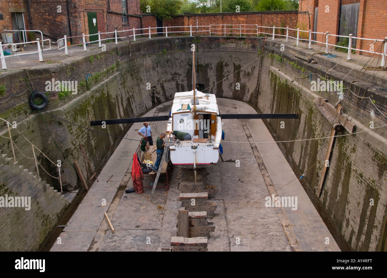 Small boat in dry dock at the docks in Gloucester Gloucestershire ...