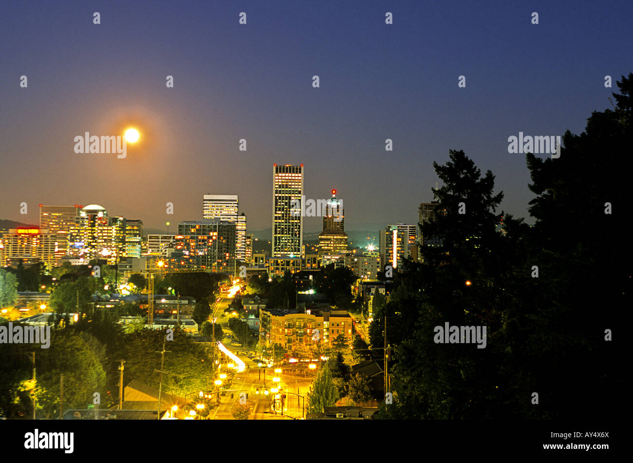 Harvest moon rising over the buildings and skyscrapers of downtown ...
