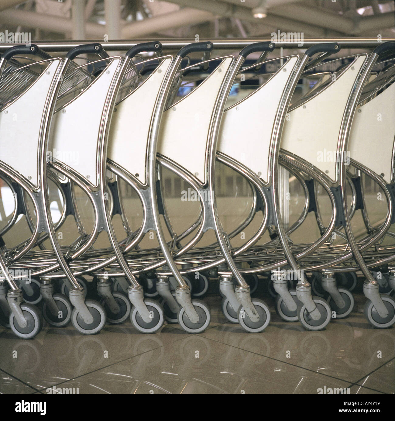 trolleys inside an international airport Stock Photo - Alamy