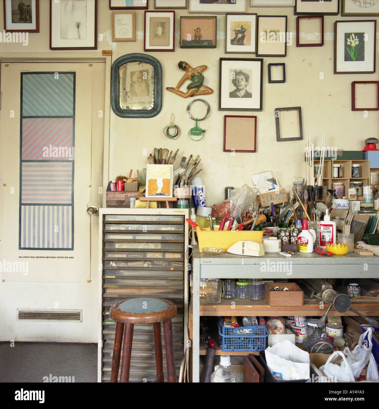 studio of an artist: detail of the wall with several frames and ...