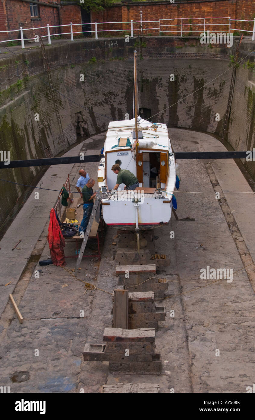 Small boat in dry dock at the docks in Gloucester Gloucestershire ...