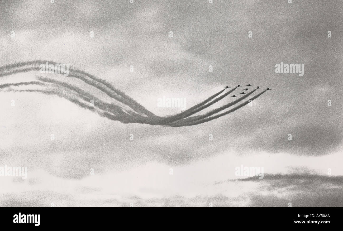 Formation of eight jet planes with vapour trails Stock Photo - Alamy