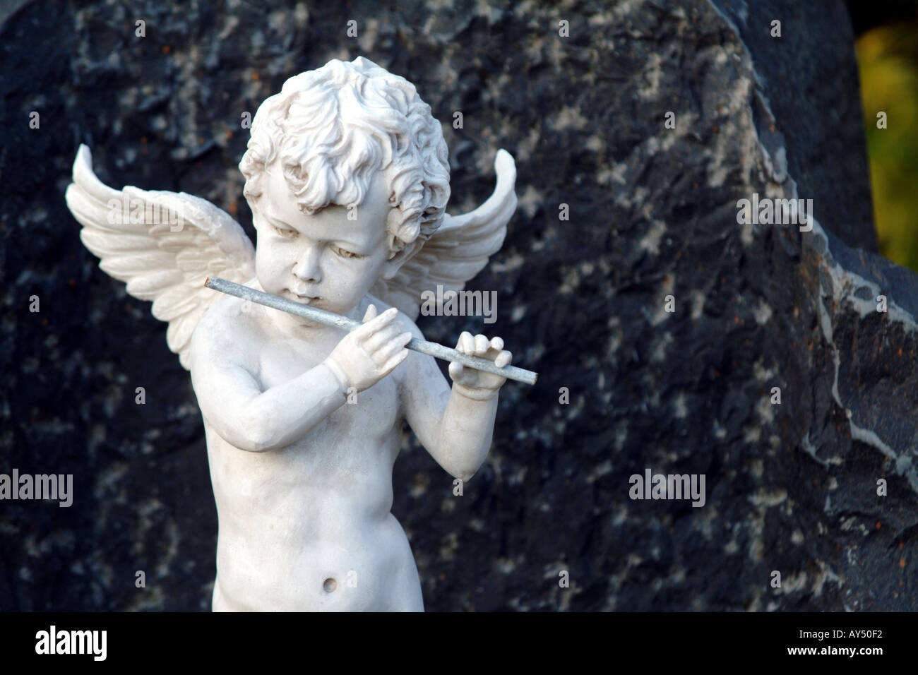 Statue cherub flute hi-res stock photography and images - Alamy
