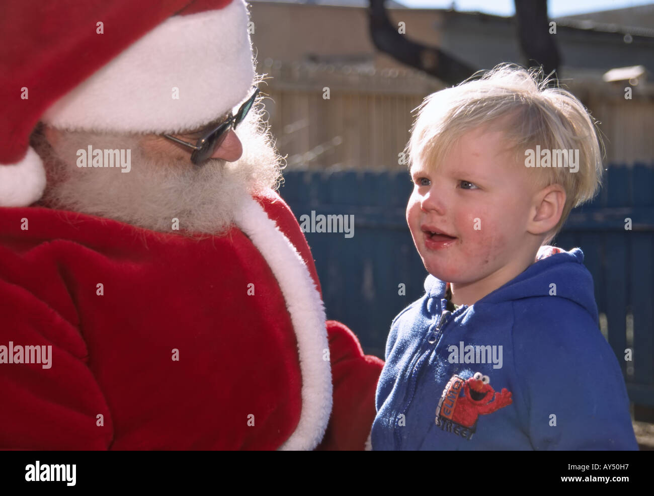 Richard Rumph as Santa Claus, listens to Christmas wishes, at the ...