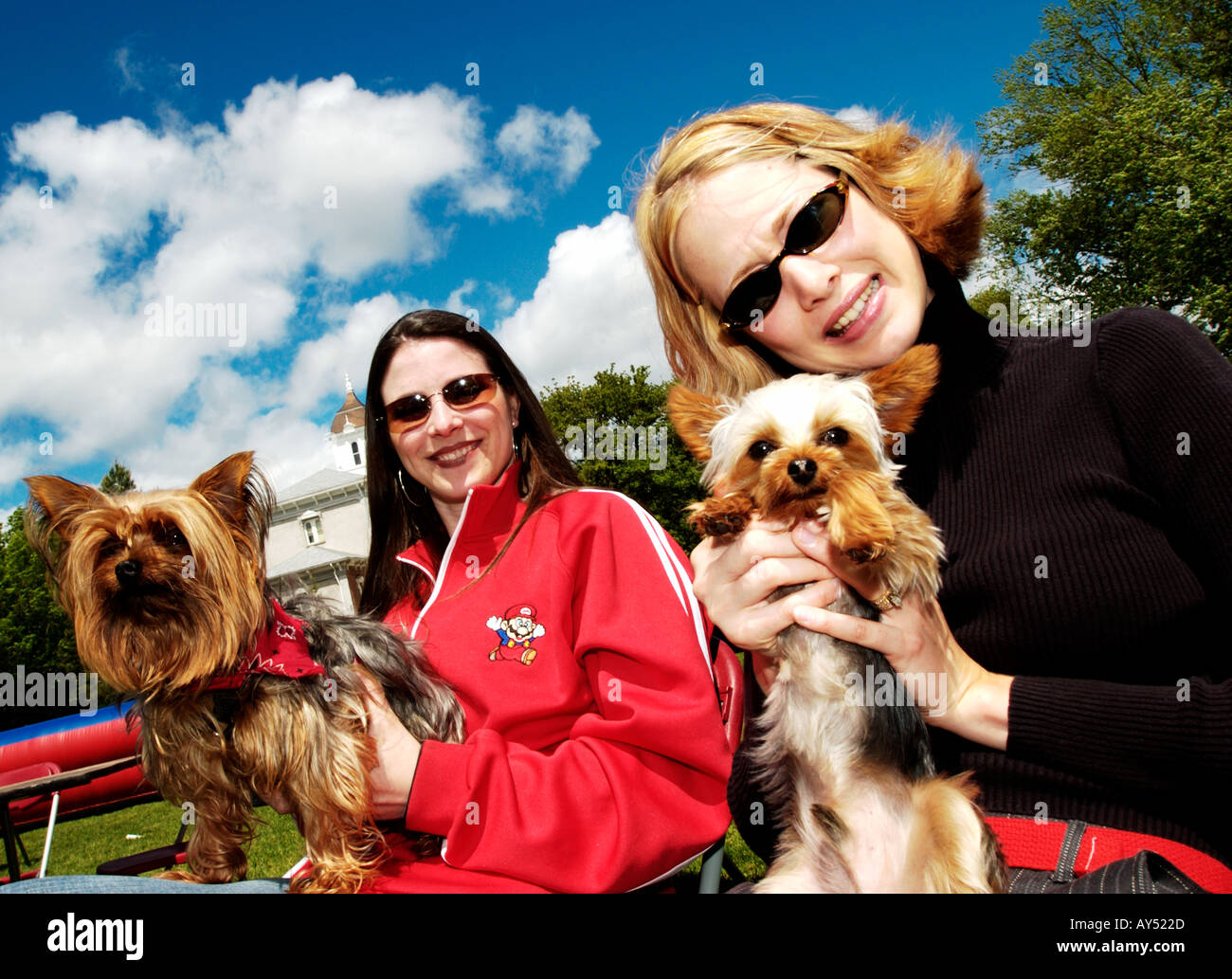 Two girls with pet dogs Stock Photo - Alamy