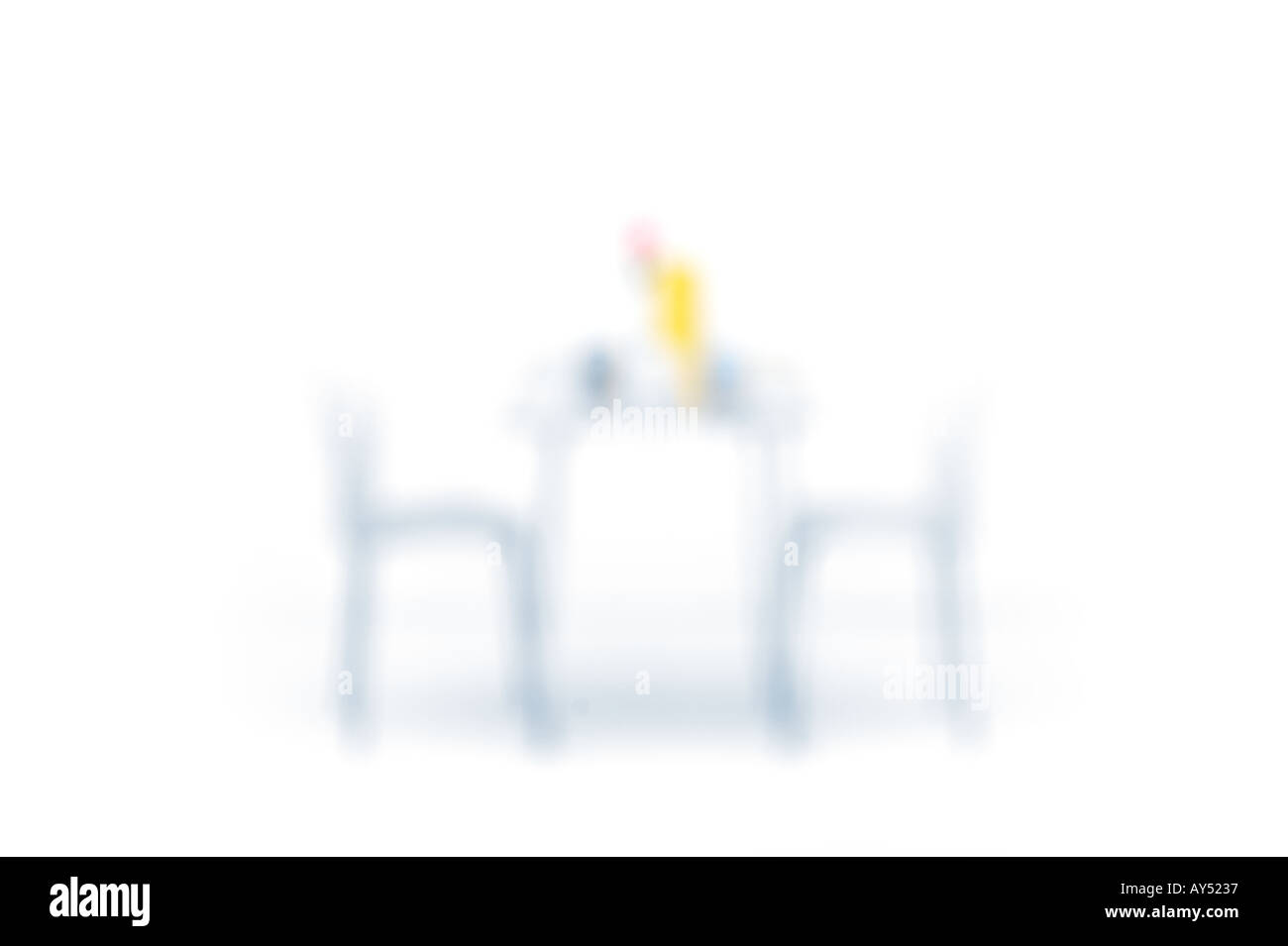 Blurred table and chairs on a white background Stock Photo - Alamy