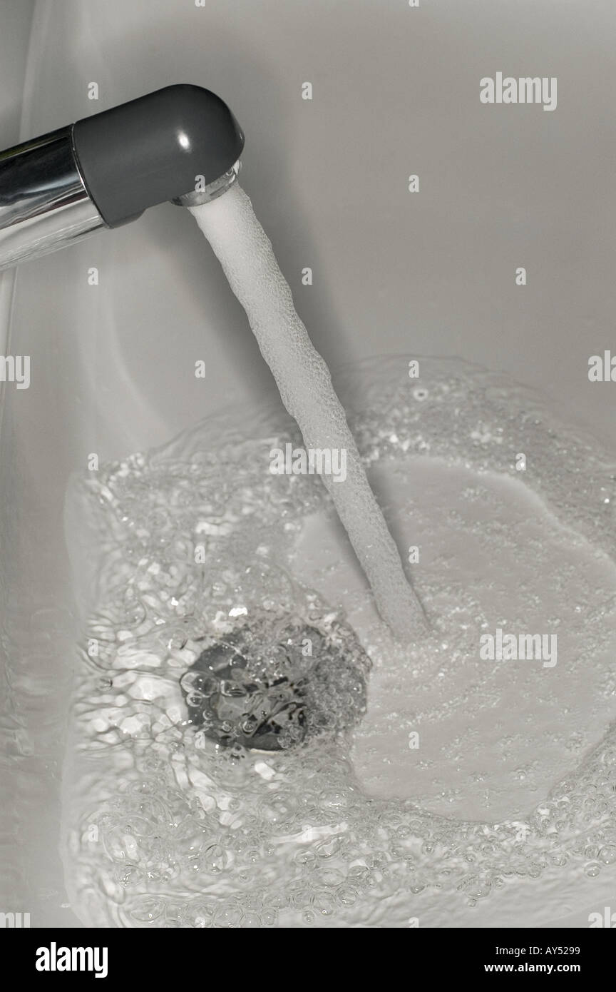 WATER RUNNING OUT OF TAP Stock Photo - Alamy
