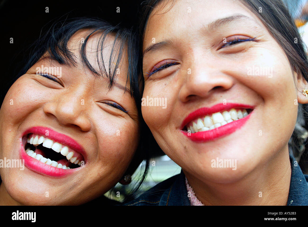 Close sisters laughing together hi-res stock photography and images - Alamy