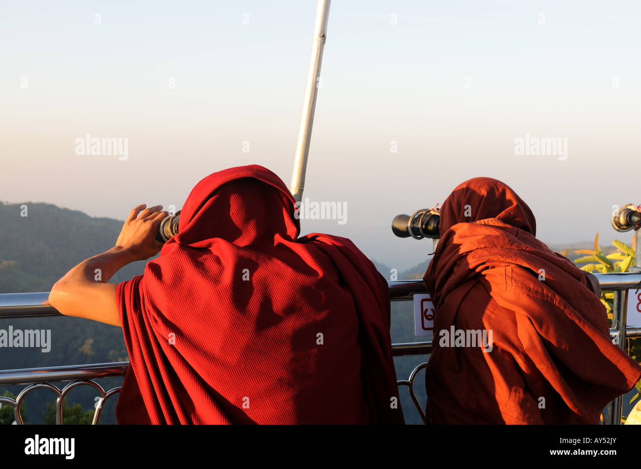 Pilgrim monks watching the scenery at the golden rock Kytiku Myanmar ...
