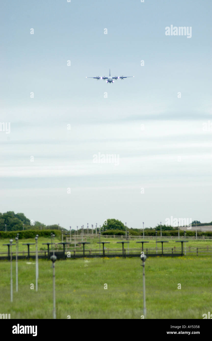 Hercules transport plane approaching a landing Stock Photo - Alamy