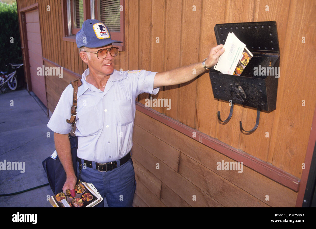 Letter Carrier Delivering A Letter High Resolution Stock Photography ...