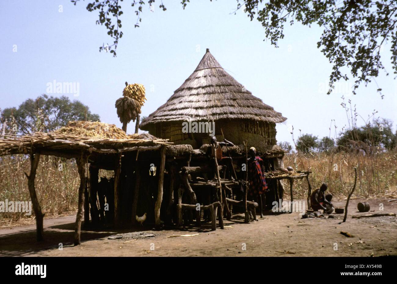 Tukul Village and Family Reclining Stock Photo - Alamy