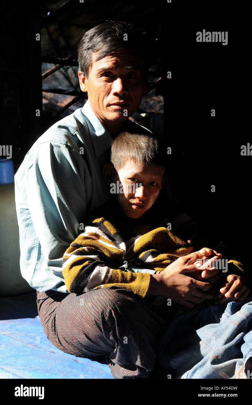 Father and son during their pilgrimage at the golden rock Kytiku ...