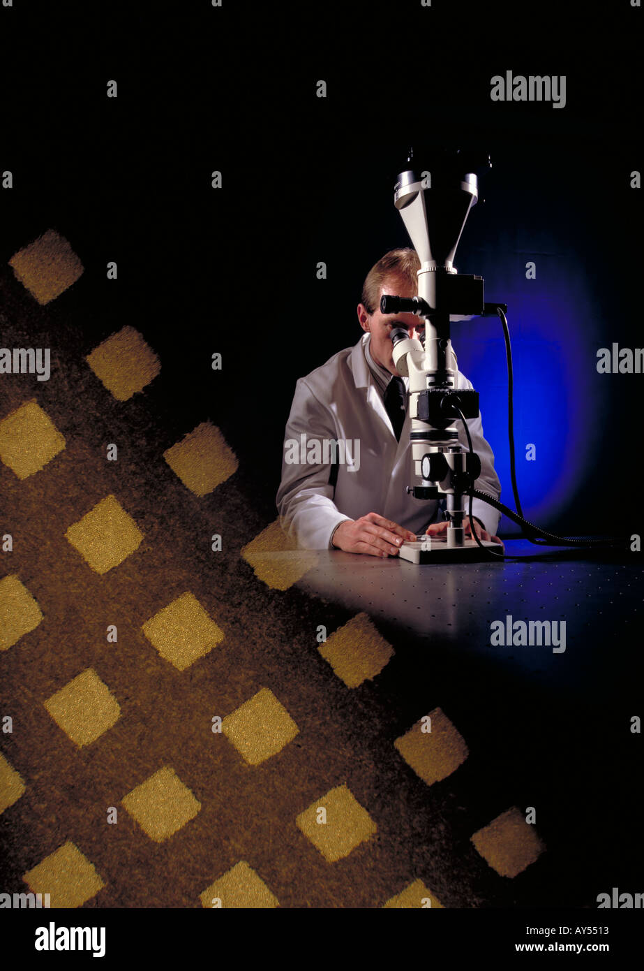 Technician studying of solder particles through a microscope Stock ...