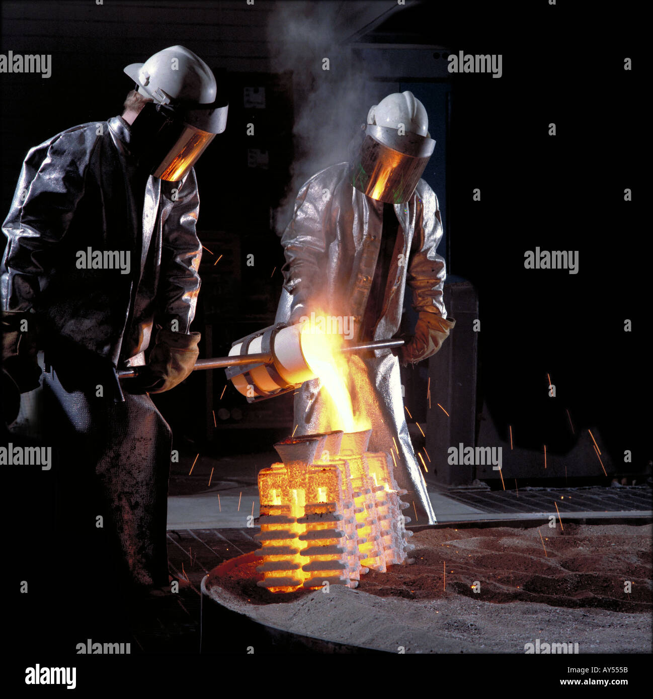 Pouring of molten titanium into moulds for aerospace industry in ...