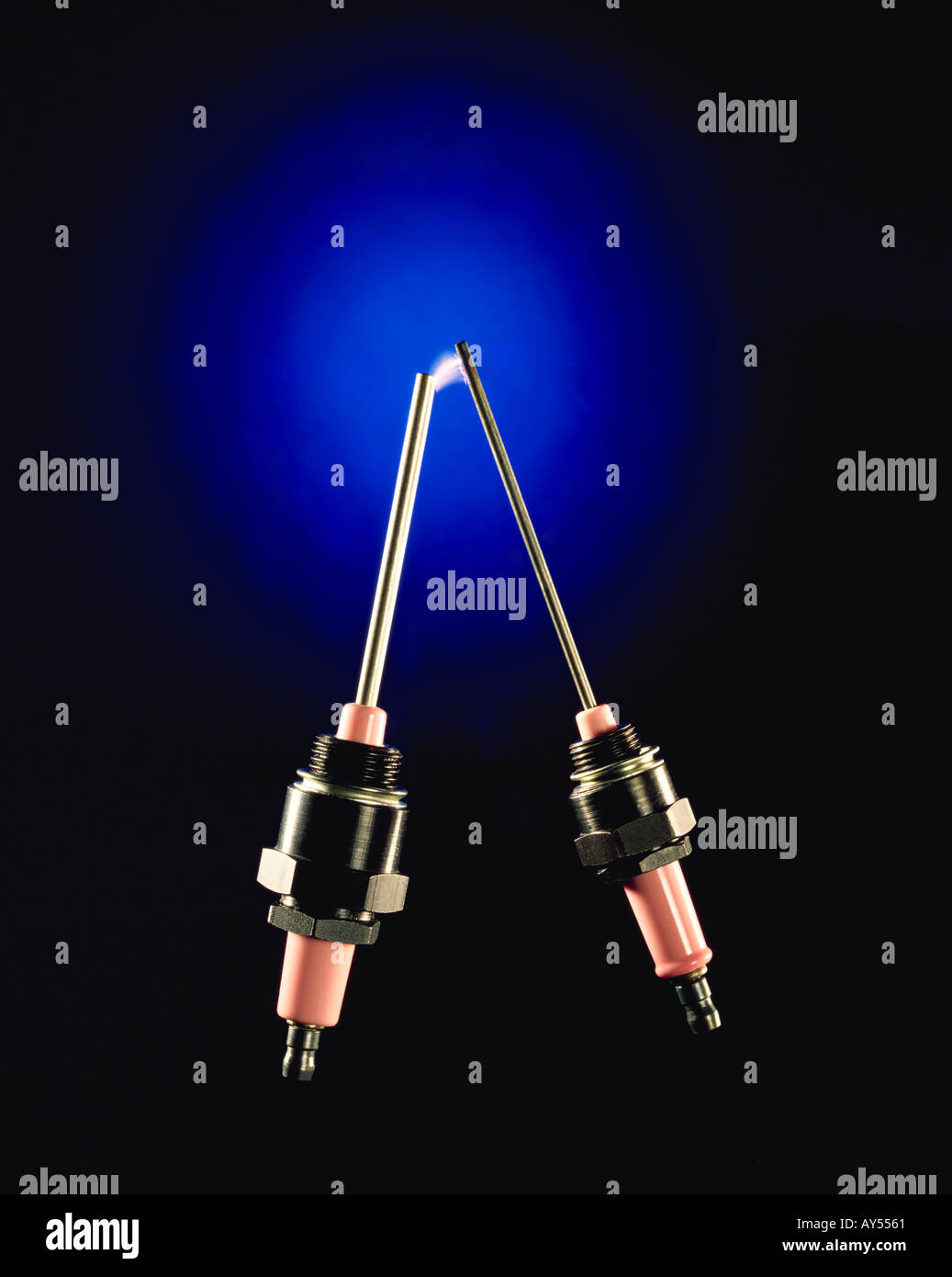 Spark plugs igniting showing ceramic element components Stock Photo - Alamy