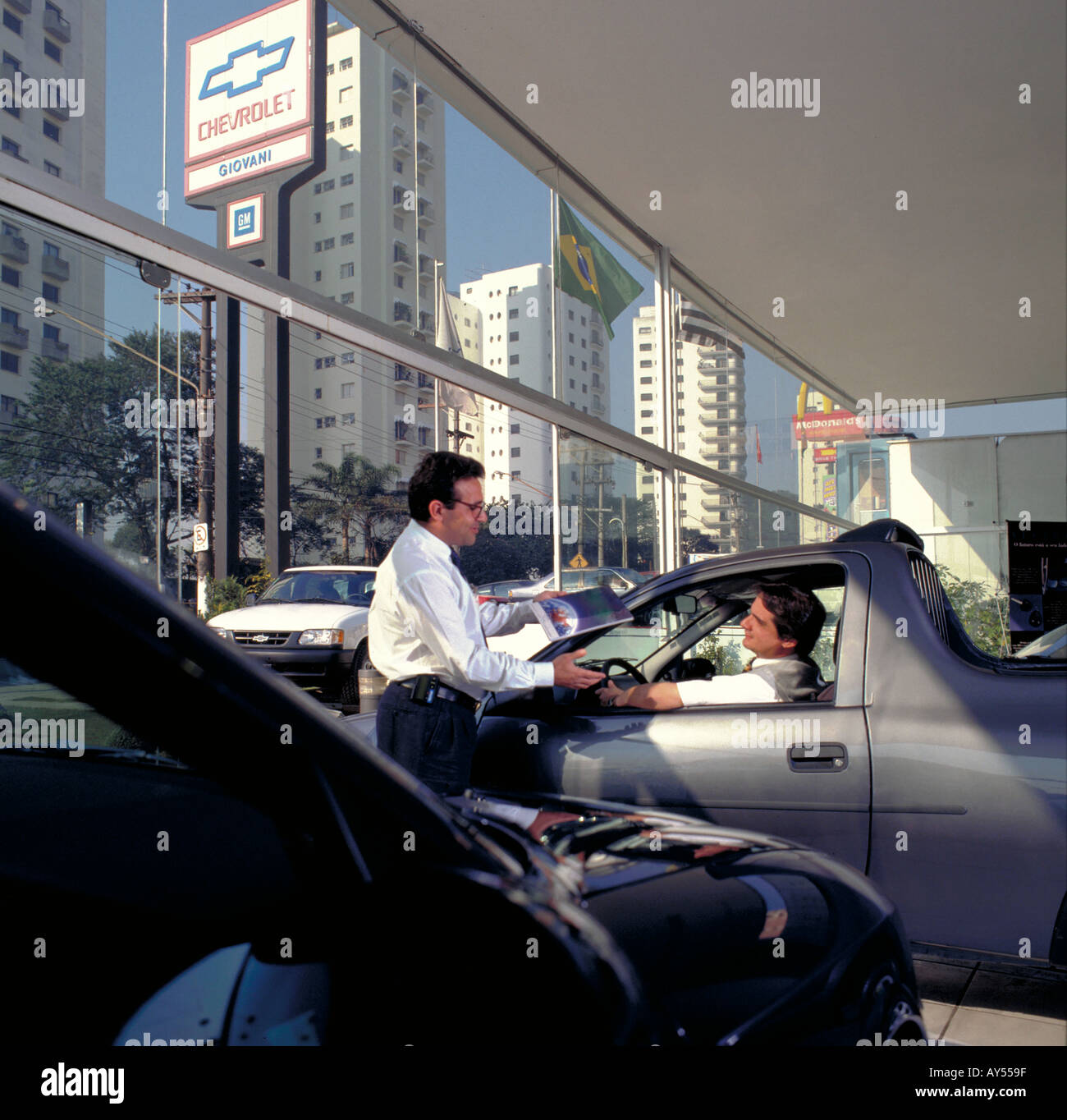 Chevrolet car show room with dealer talking to customer Sao Paulo ...