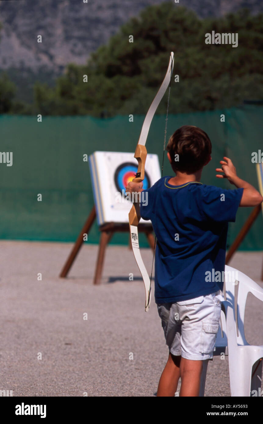 Child shooting arrow hi-res stock photography and images - Alamy