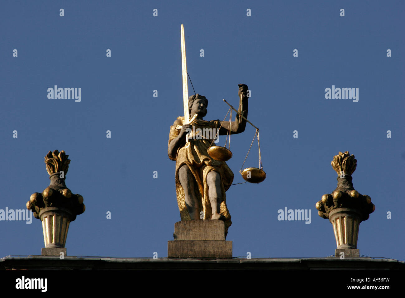 statue with sword and balance on a roof in Gdansk Poland Stock Photo ...