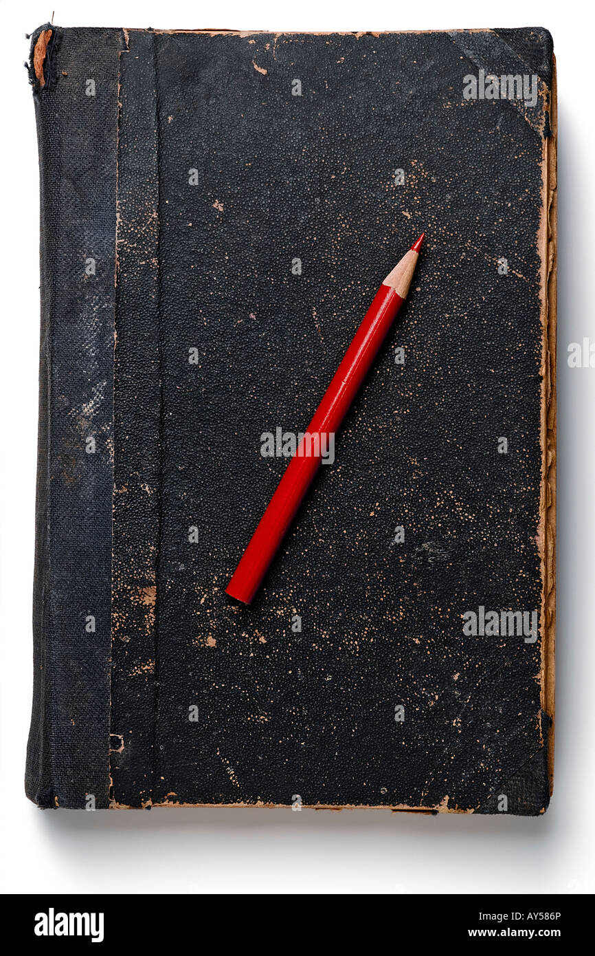 a red pencil on an old book Stock Photo - Alamy