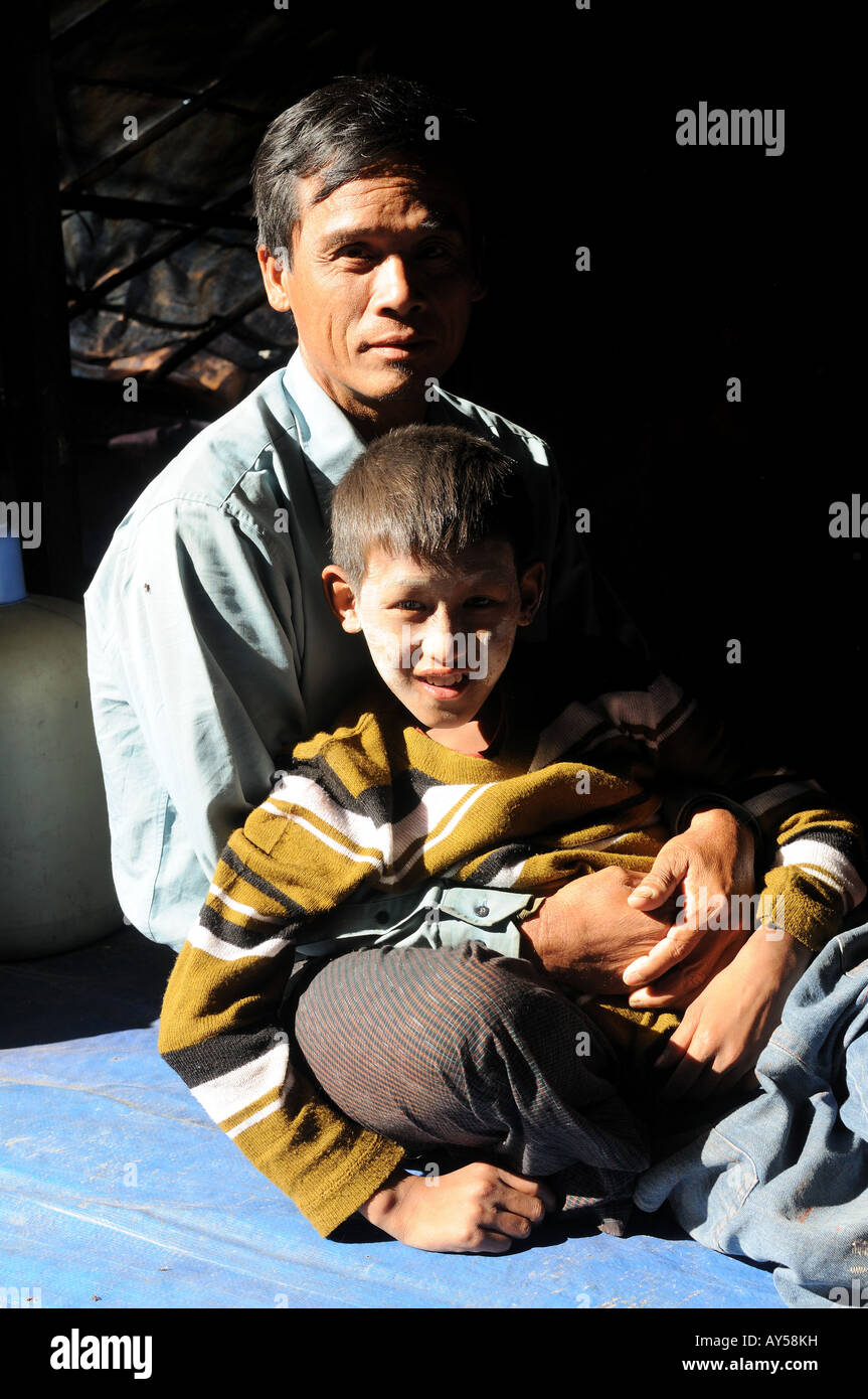 Father and son during their pilgrimage at the golden rock Kytiku ...