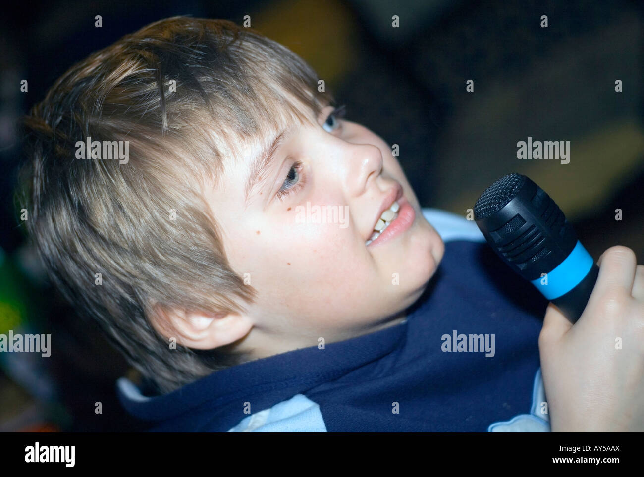 Kid having fun, singing karaoke Stock Photo - Alamy